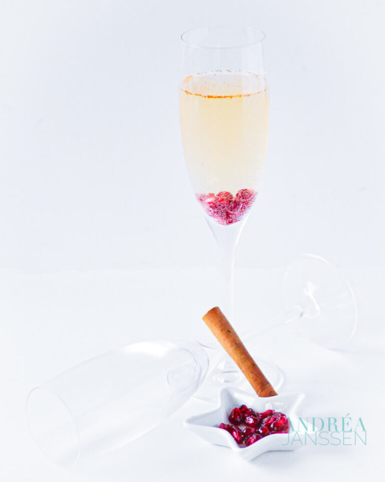 Pomegranate prosecco cocktail with cinnamon - By Andrea Janssen
